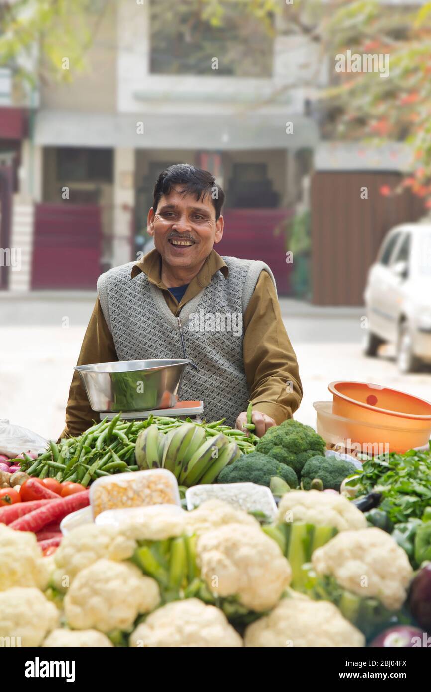 Man selling vegetables hi-res stock photography and images - Alamy