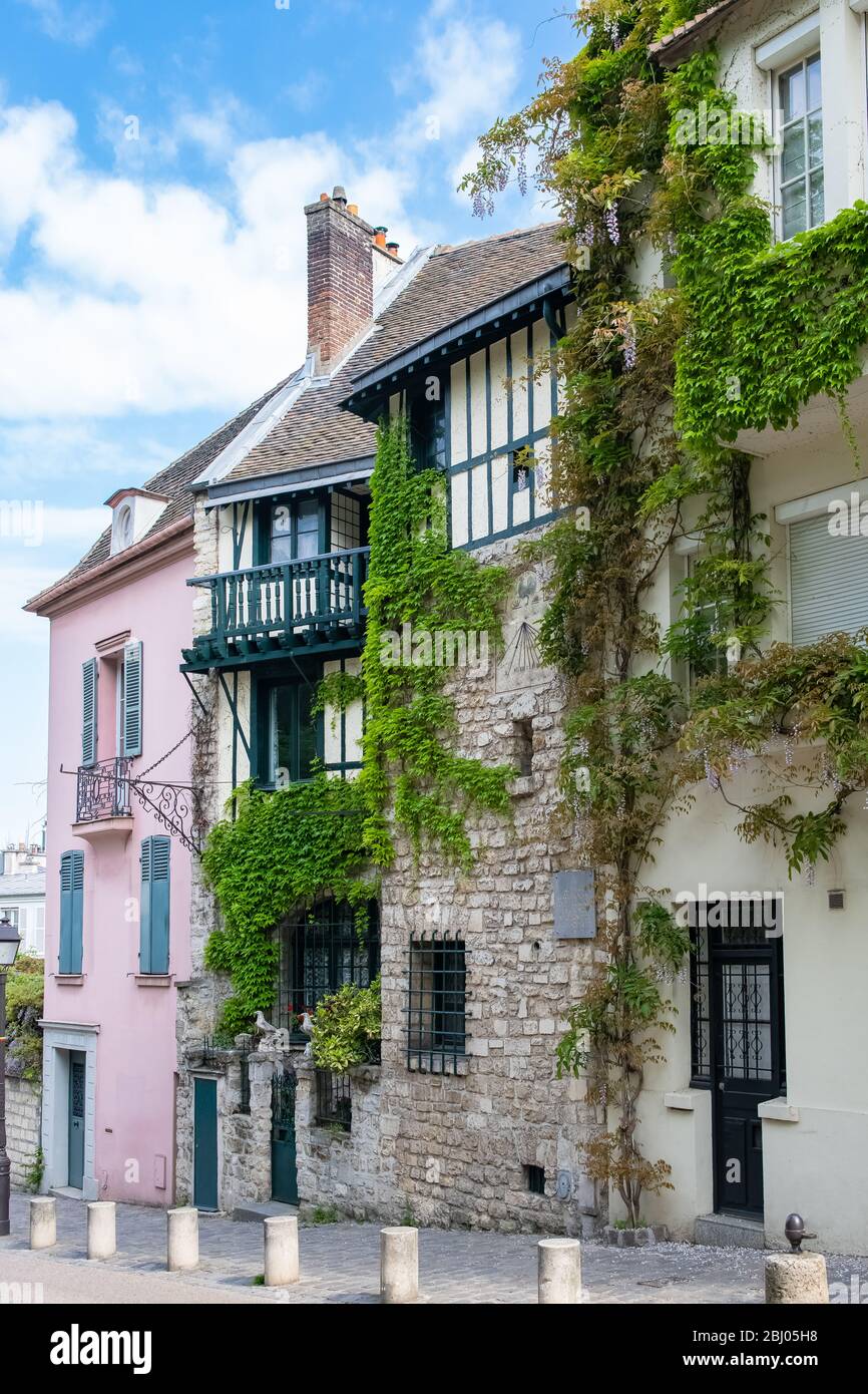 Paris, France, famous pink house and buildings in Montmartre, in a ...