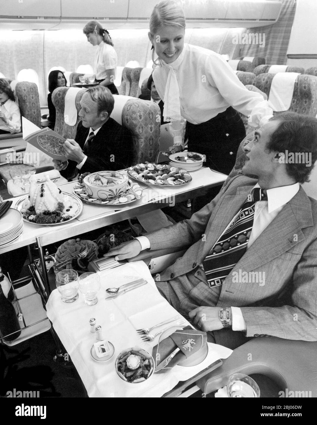 Air hostess serving food hi-res stock photography and images - Alamy