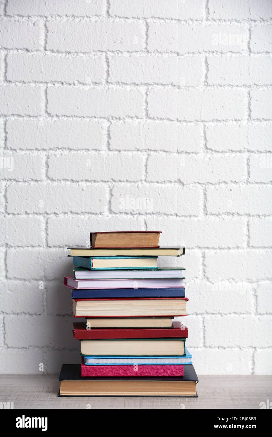Stack of books on shelf Stock Photo - Alamy