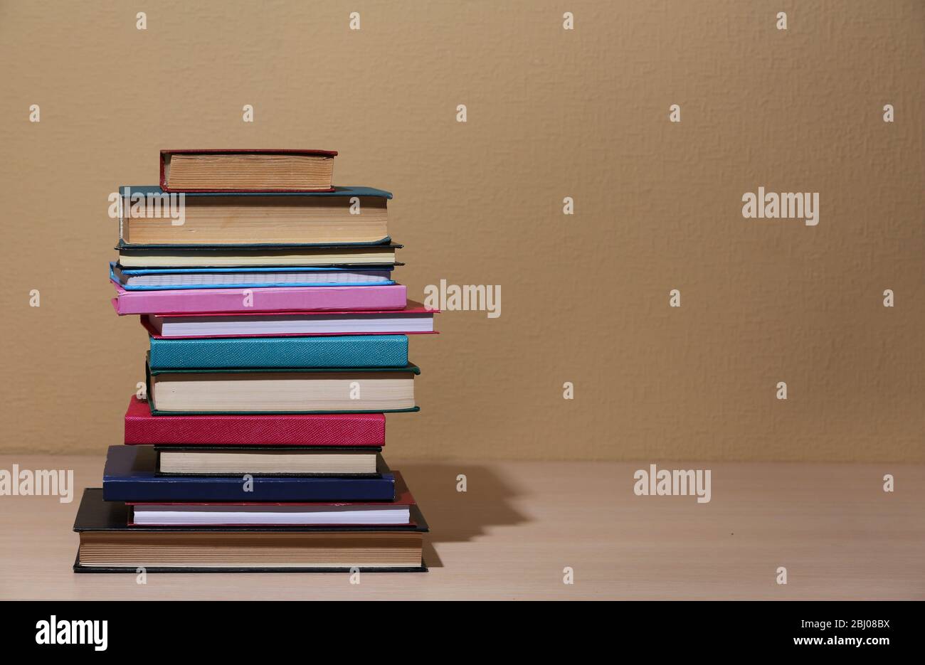 Stack of books on shelf Stock Photo - Alamy