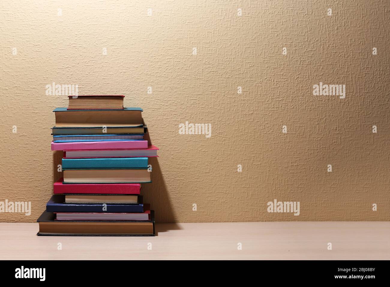 Stack of books on shelf Stock Photo - Alamy