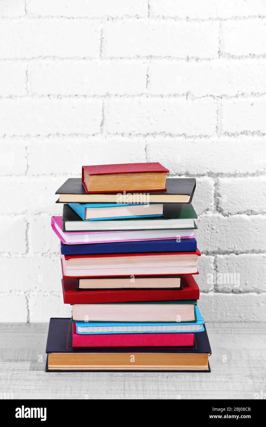 Stack of books on shelf Stock Photo - Alamy