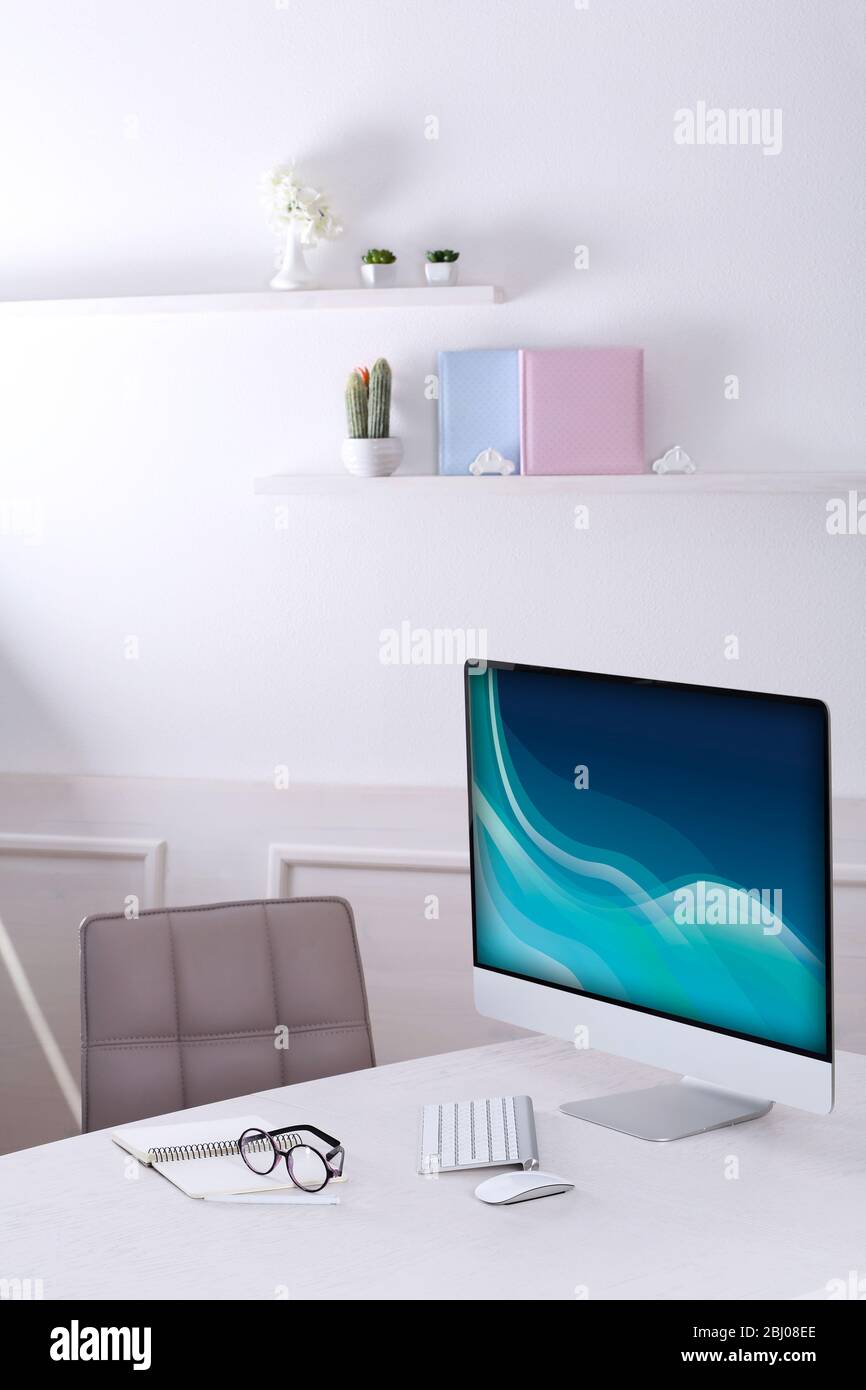 Workplace with computer in room Stock Photo - Alamy