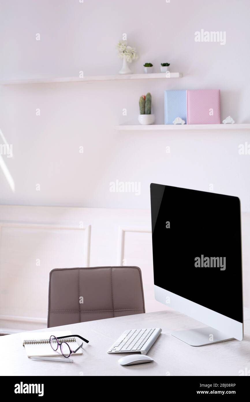 Workplace with computer in room Stock Photo - Alamy