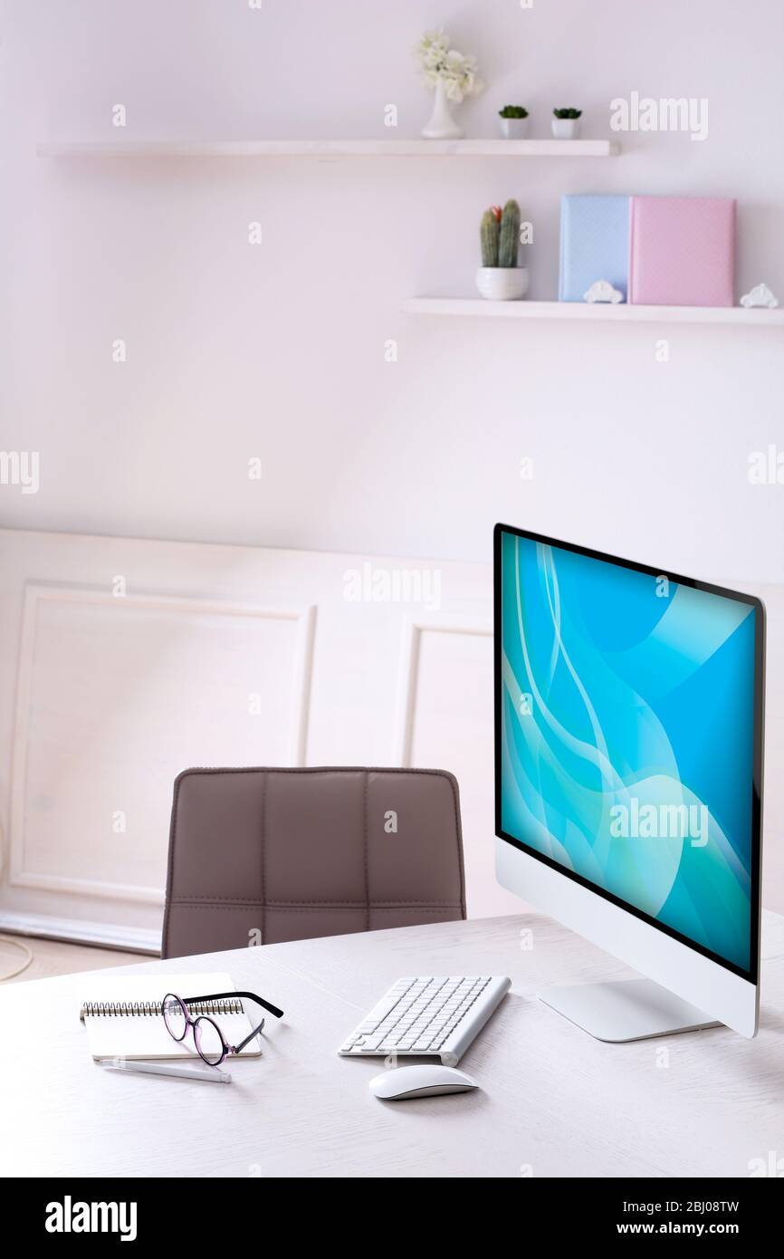 Workplace with computer in room Stock Photo - Alamy