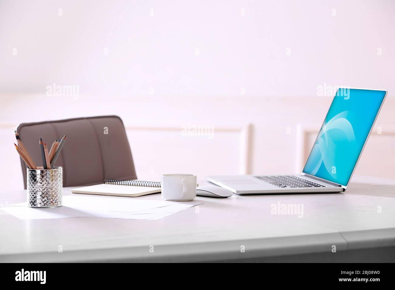 Workplace with laptop in room Stock Photo - Alamy