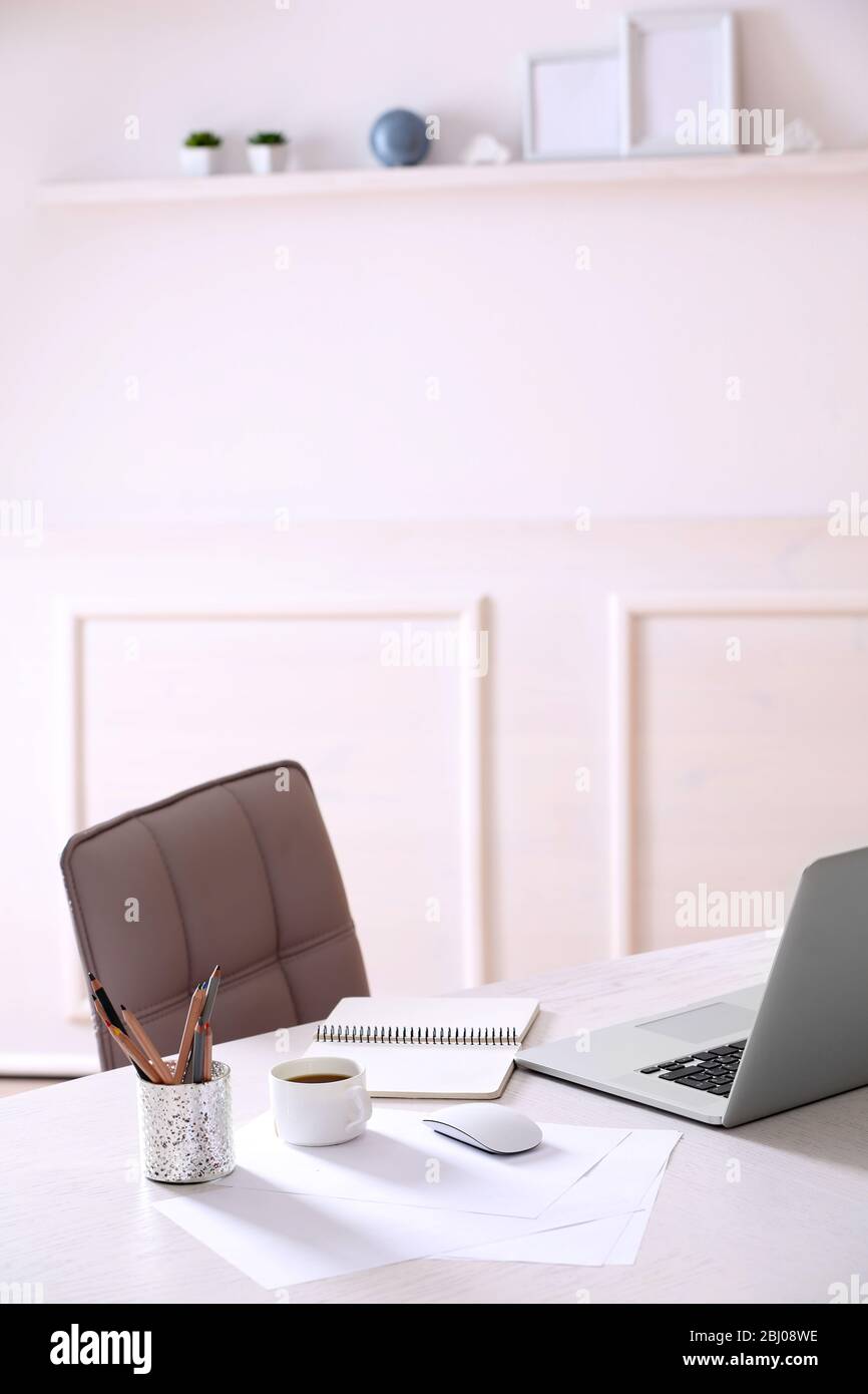 Workplace with laptop in room Stock Photo - Alamy
