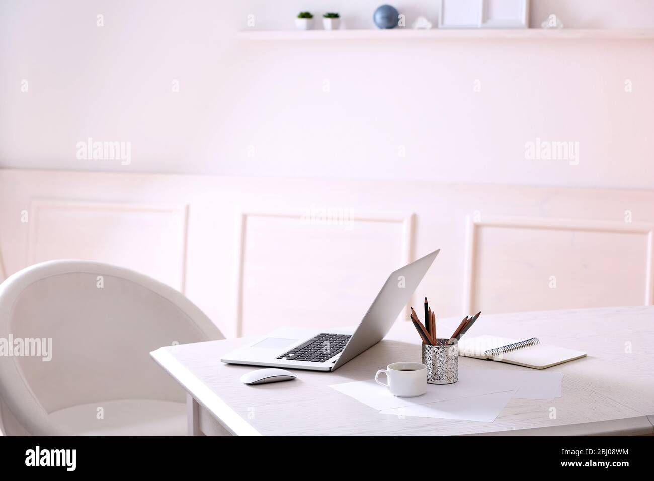 Workplace with laptop in room Stock Photo - Alamy