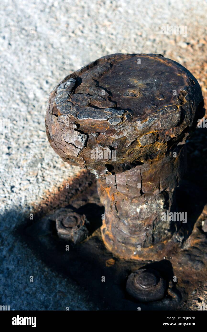 High angle high contrast image of a rusted bollard, falling into pieces ...