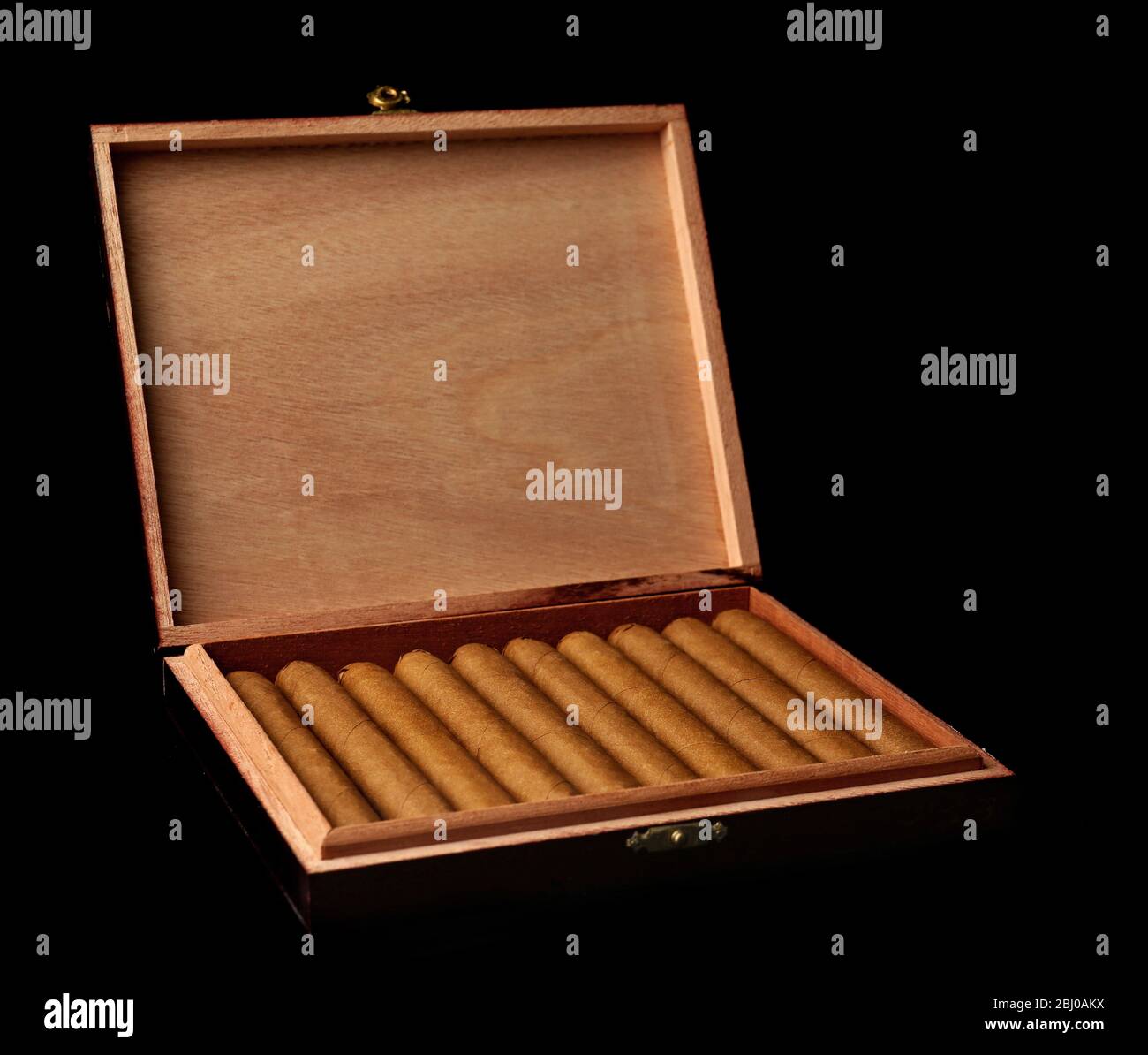 Cigars in box on black background Stock Photo - Alamy