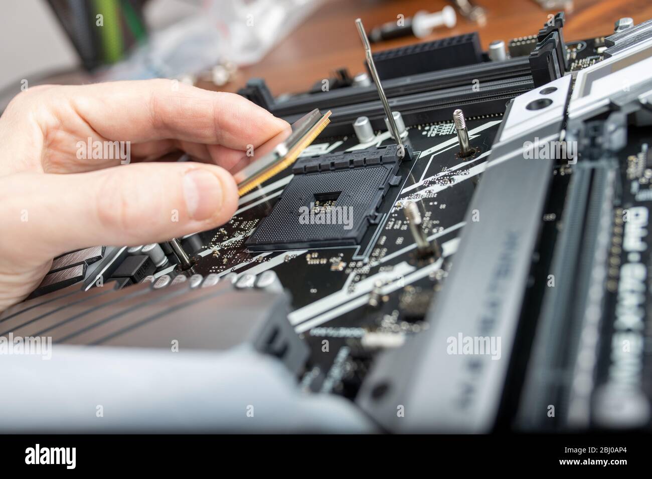 Computer technician installing CPU into motherboard. Close up Stock ... Computer technician installing CPU into motherboard. Close up Stock ...