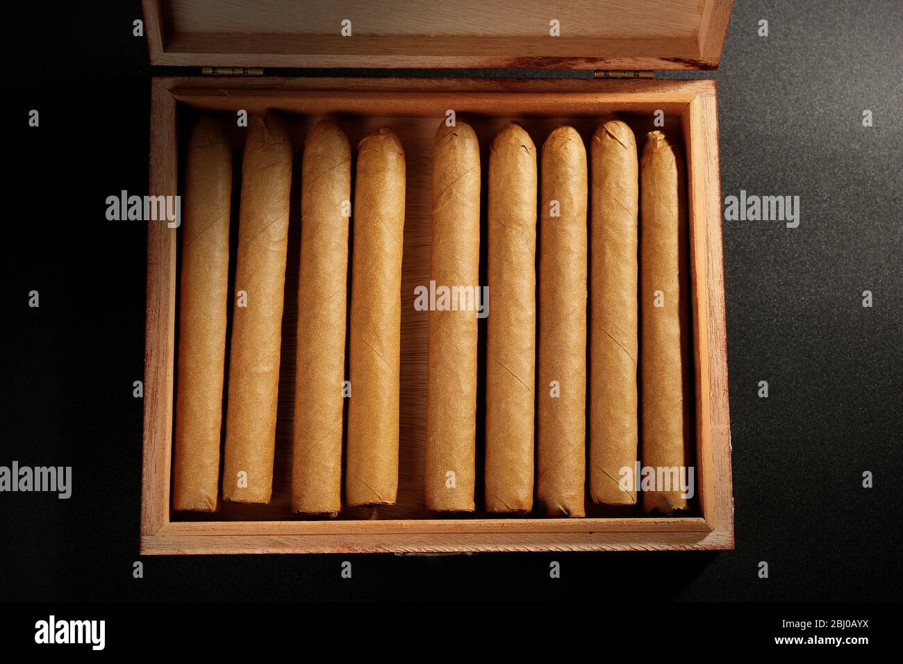 Collection of cigars in humidor on black table, top view Stock Photo ...