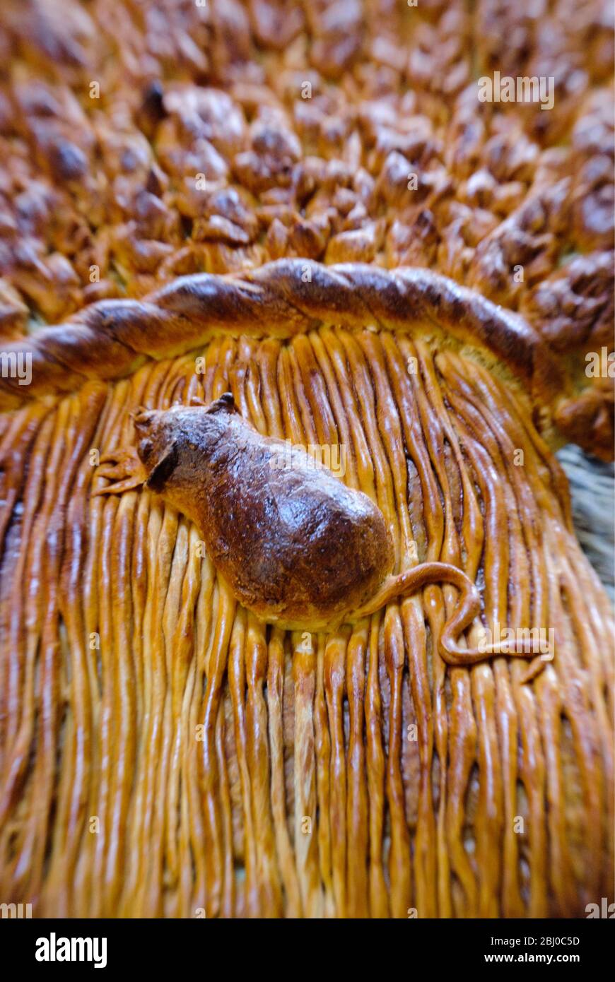 Decorative loaf in shape of sheaf of wheat with mouse for harvest ...