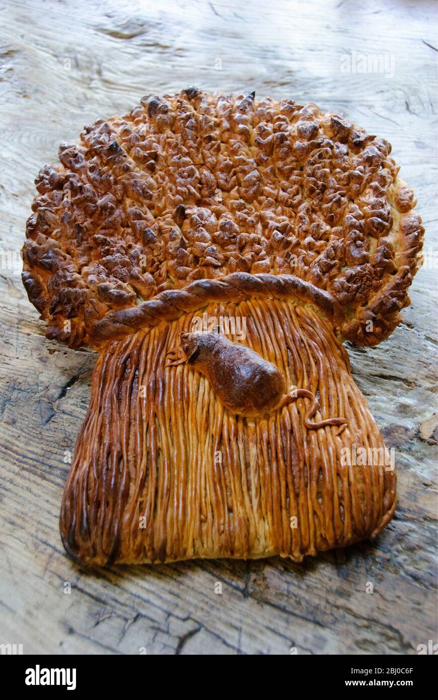 Decorative loaf in shape of sheaf of wheat with mouse for harvest ...