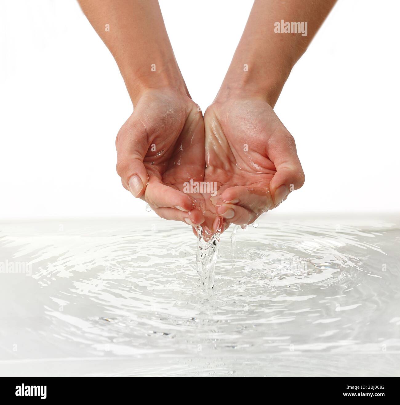 Female hands over clear water background Stock Photo - Alamy