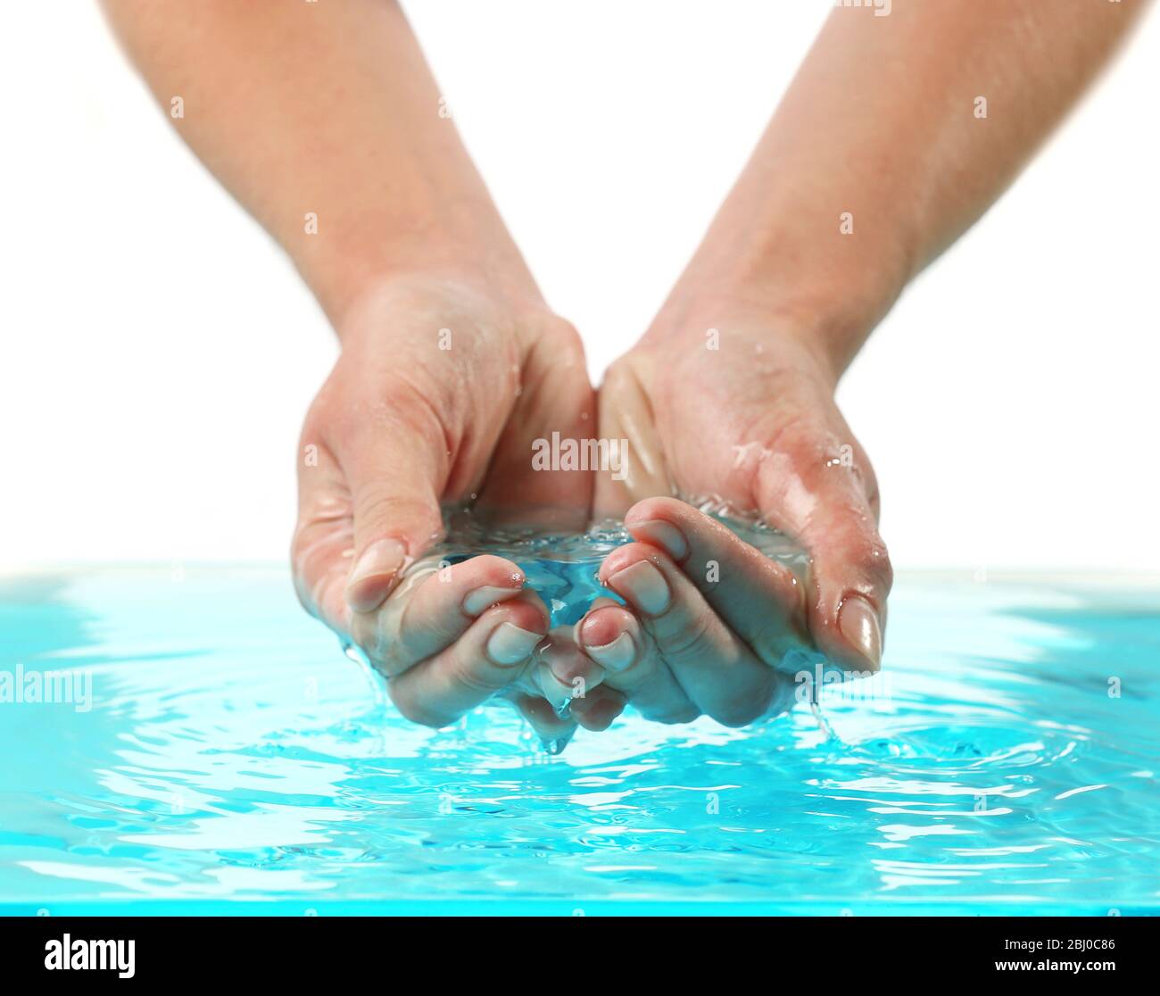 Female hands over clear water background Stock Photo - Alamy