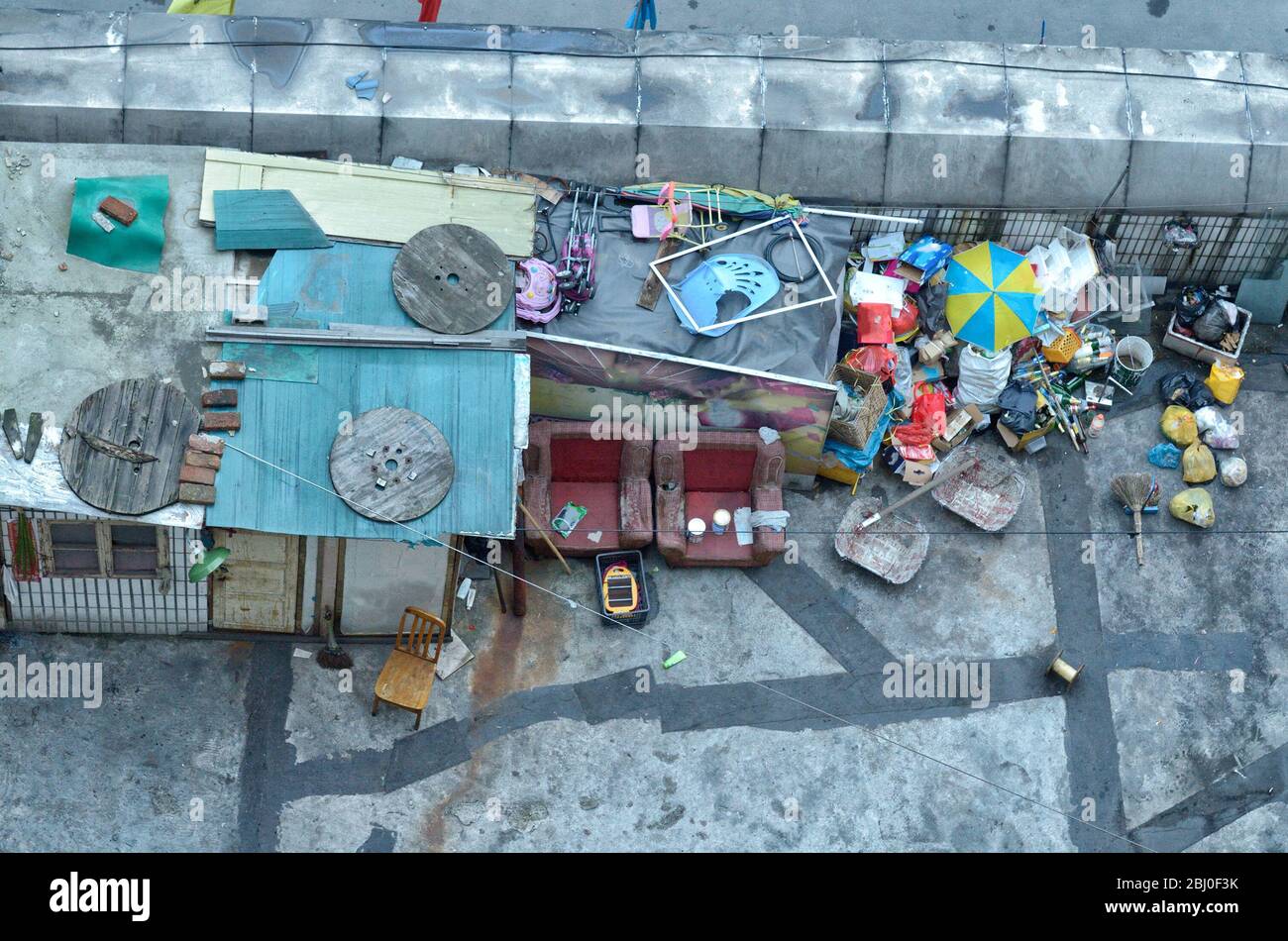 Homeless people living in rudimentary house Stock Photo - Alamy