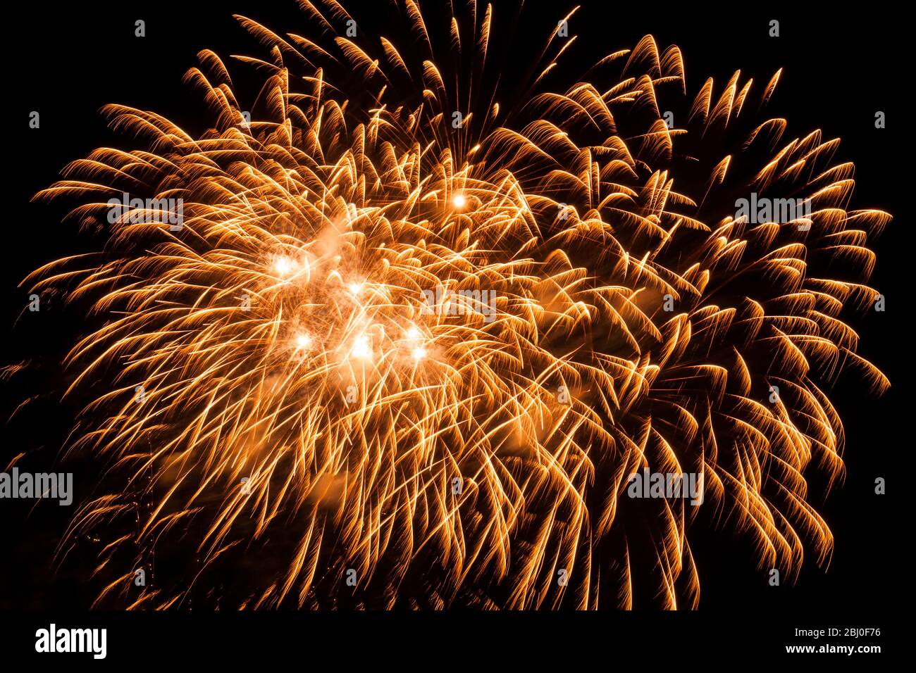 Fireworks rockets explode in the sky Stock Photo - Alamy