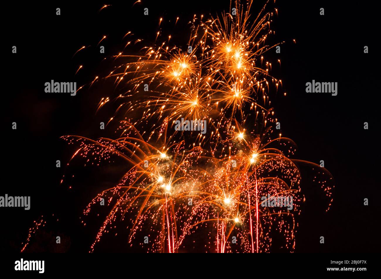Fireworks rockets explode in the sky Stock Photo - Alamy