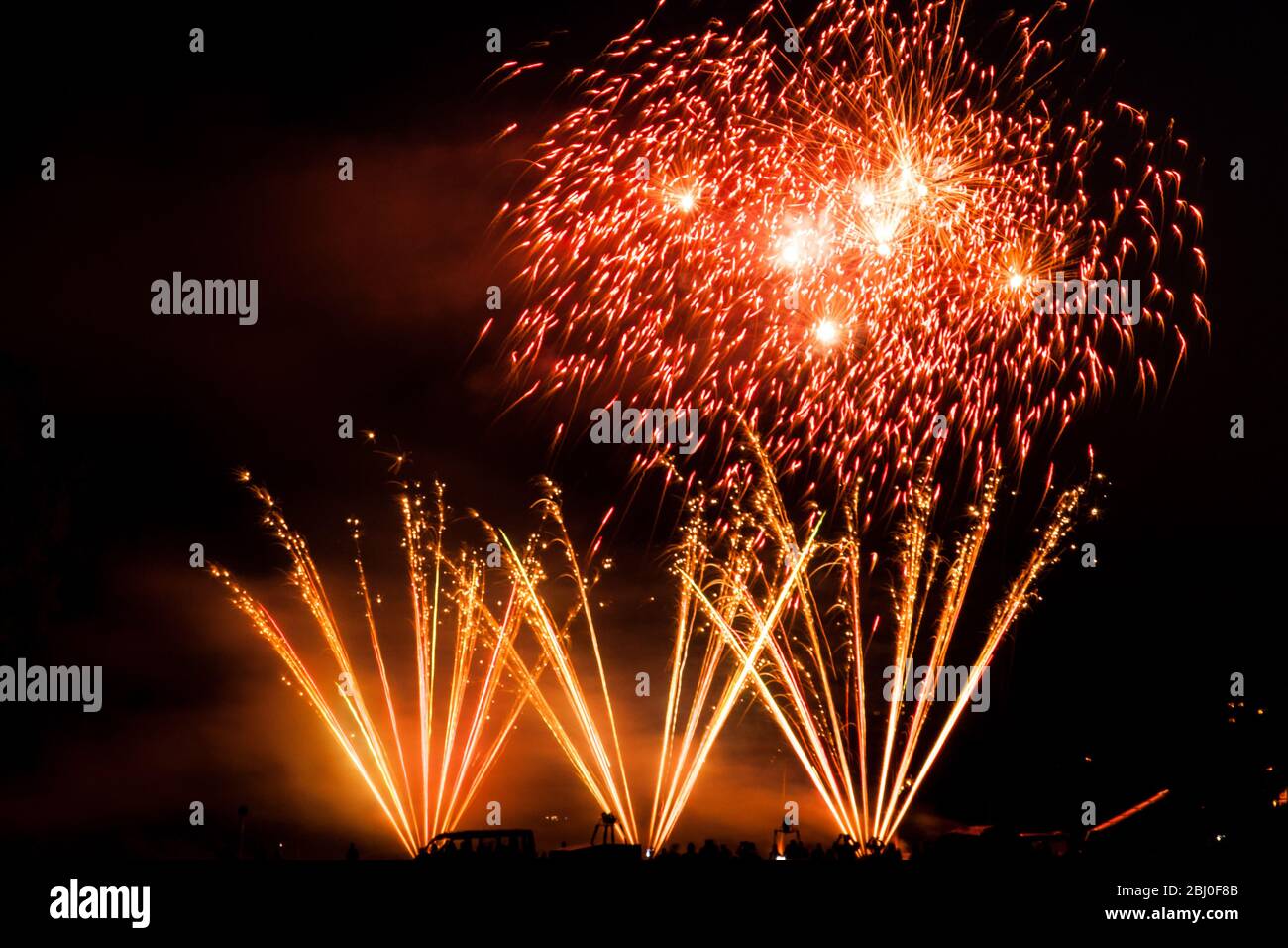 Fireworks rockets explode in the sky Stock Photo - Alamy