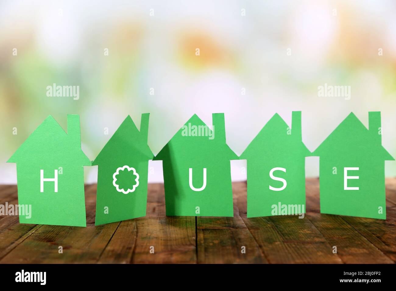 Paper houses on bright background Stock Photo - Alamy