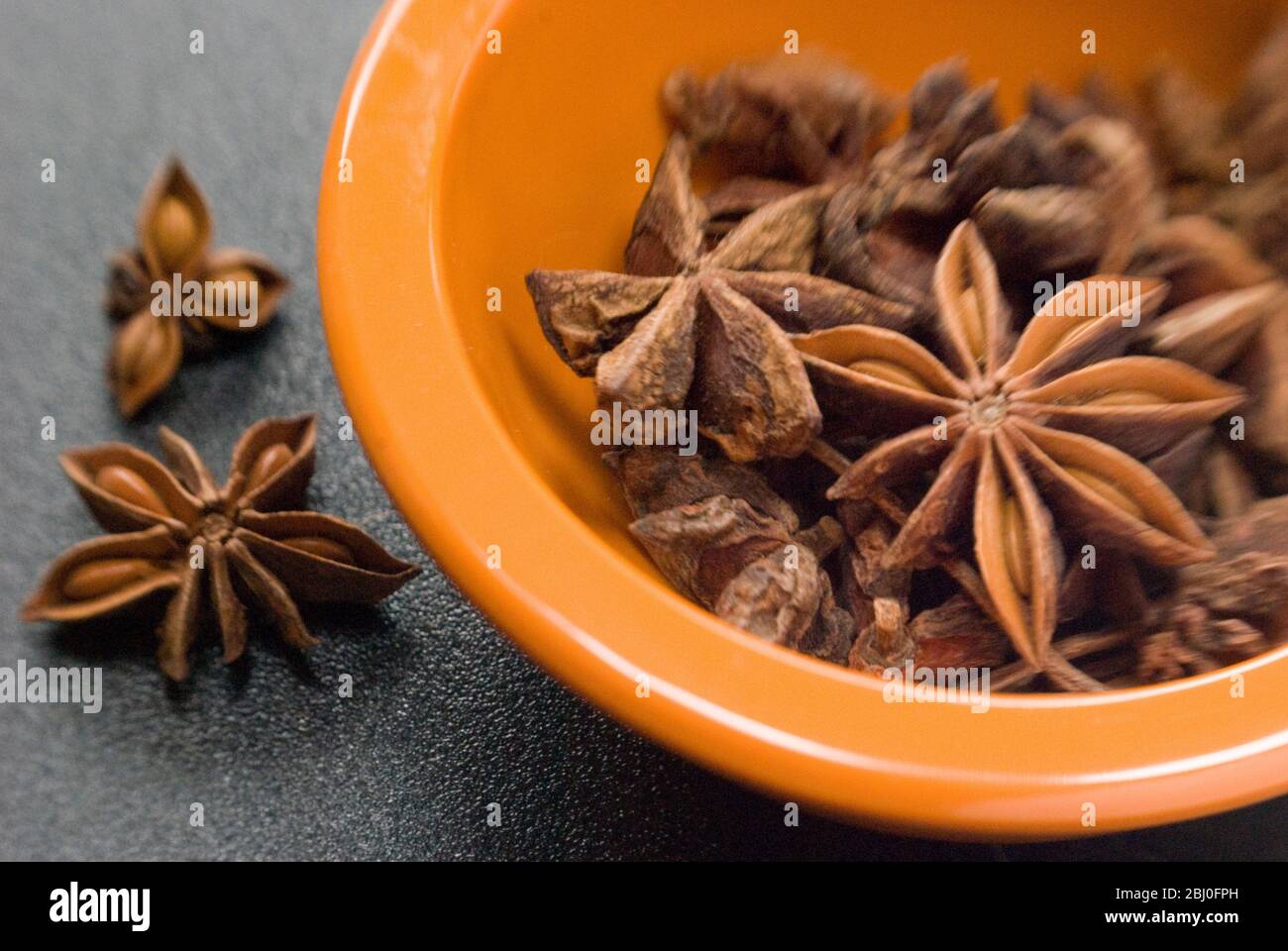Dried Star anise fruits in small bowl. Also known as star aniseed ...