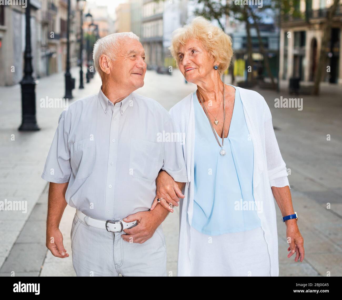 Close up of romantic happy senior couple on city streets on joint ...