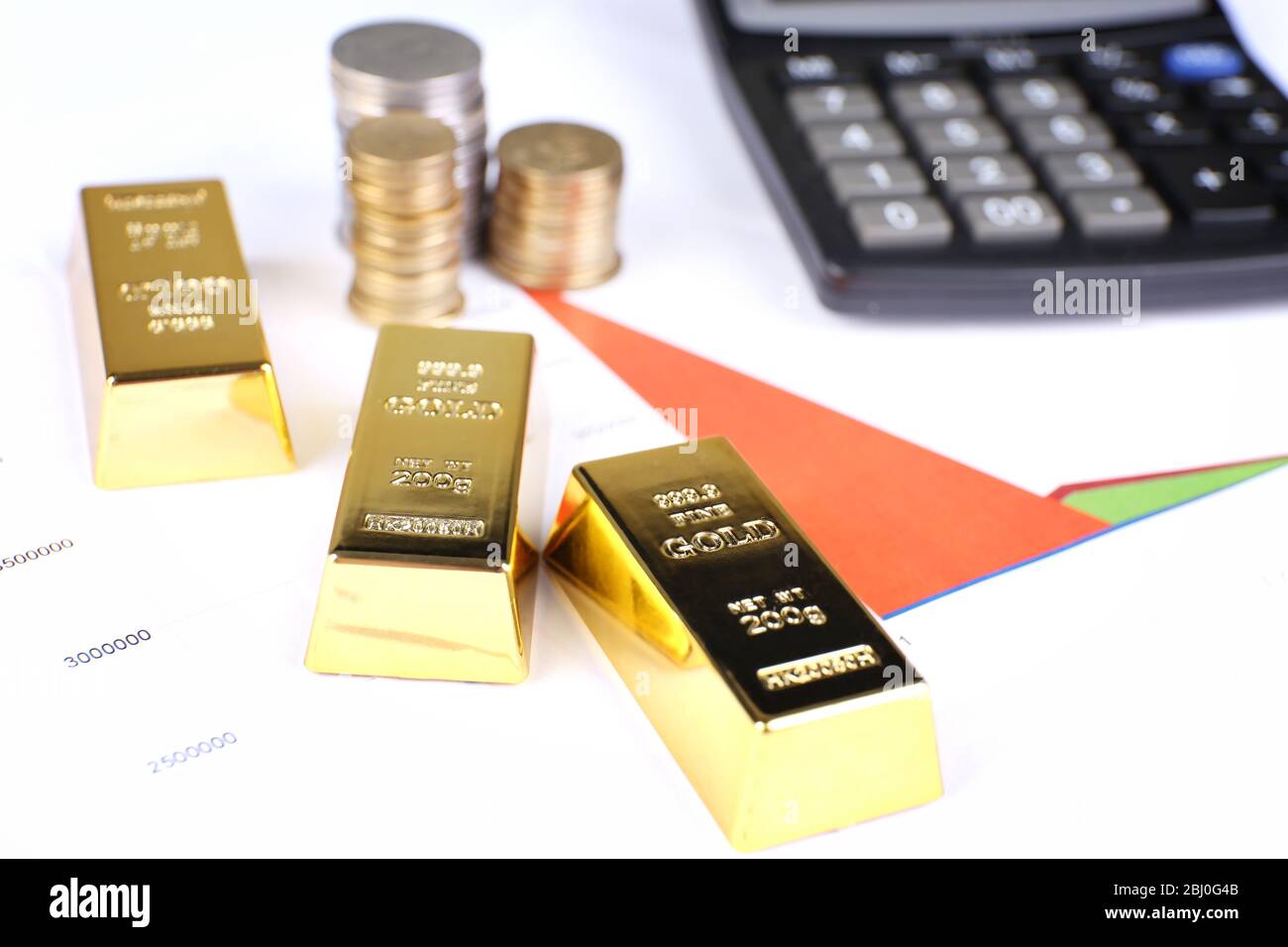 Gold bullion with coins on documents background Stock Photo - Alamy