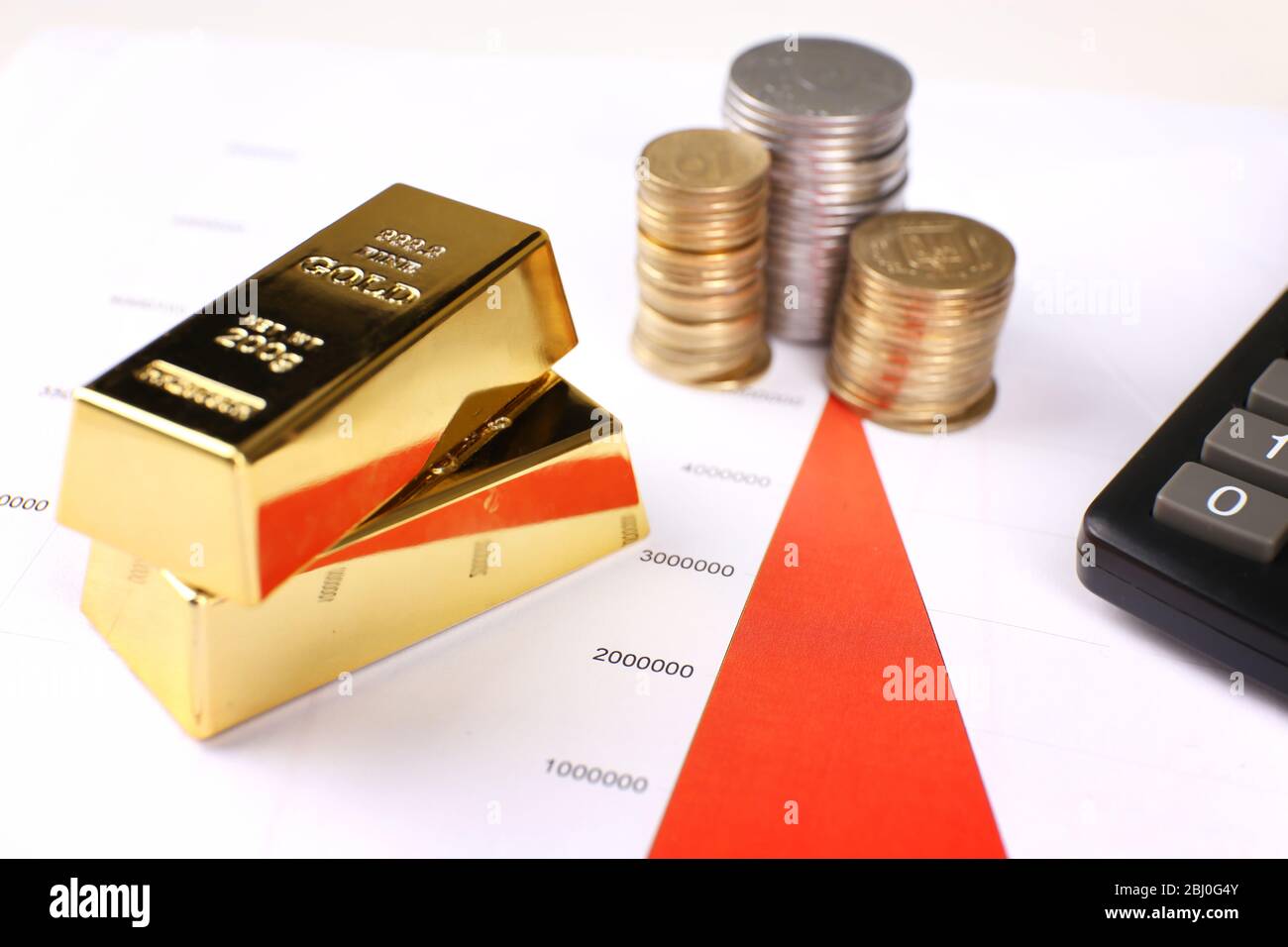 Gold bullion with coins on documents background Stock Photo - Alamy
