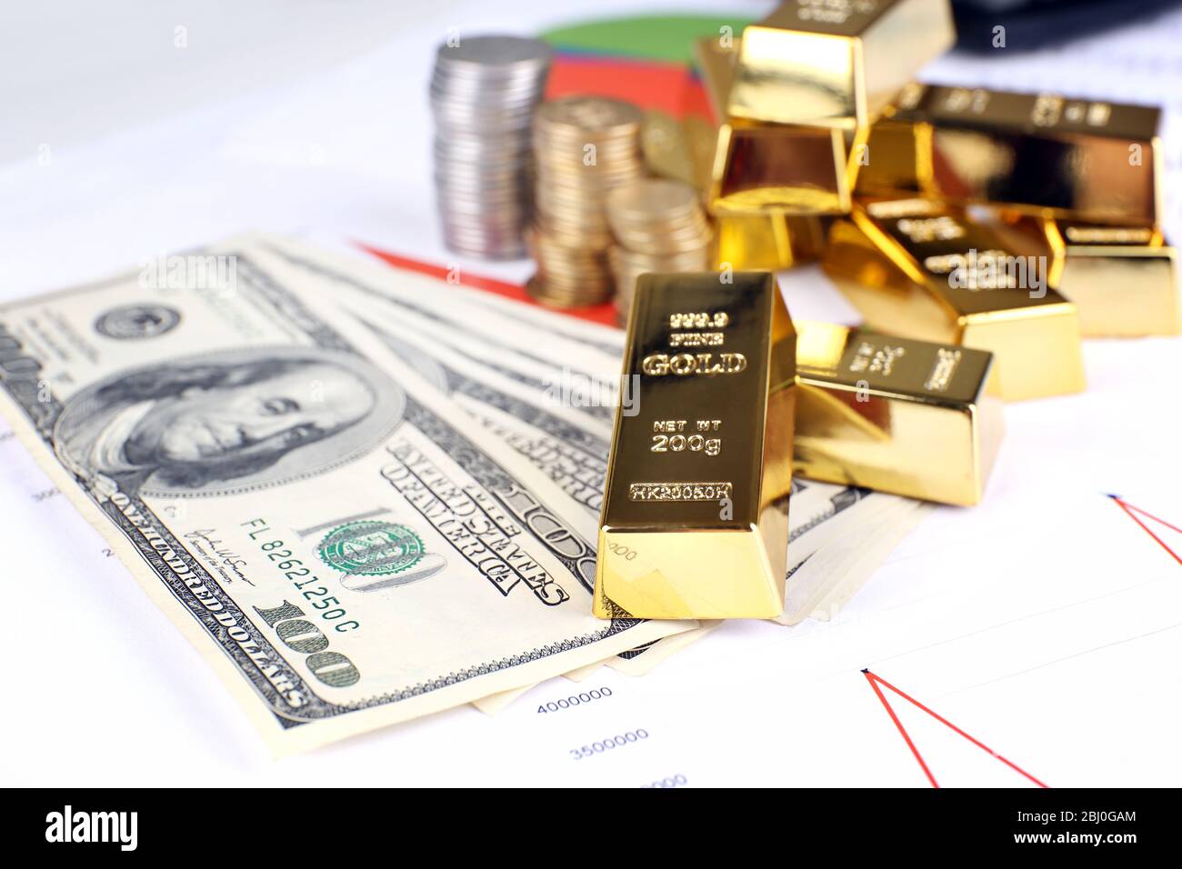 Gold bullion with money on table close up Stock Photo - Alamy
