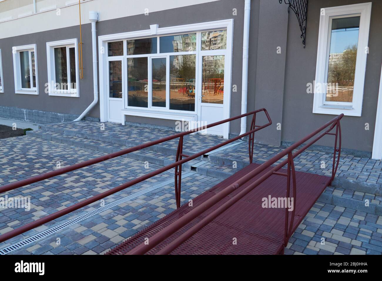 Wheelchair access ramp for entrance of residential multistory building ...