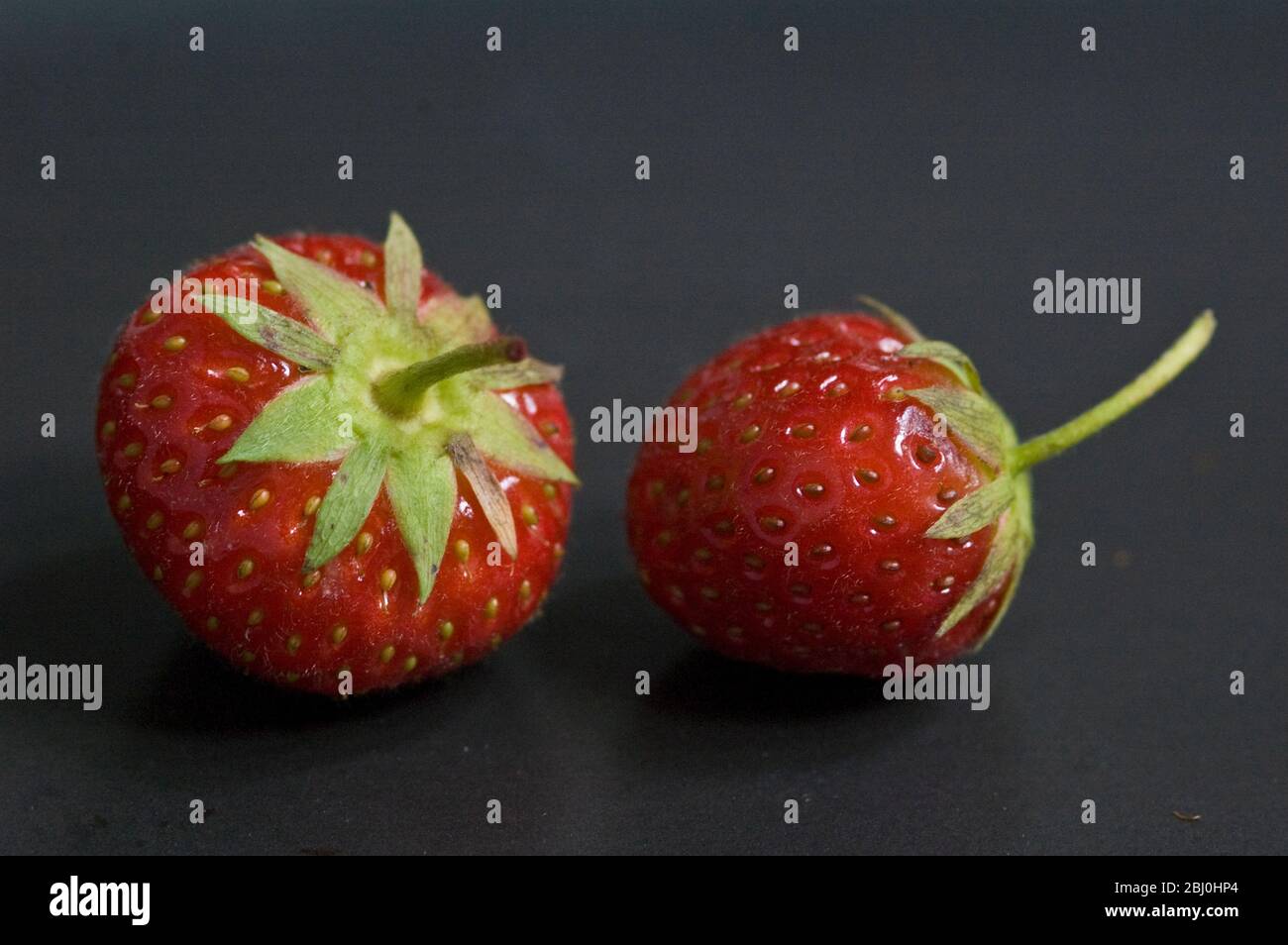 Two strawberries hi-res stock photography and images - Alamy