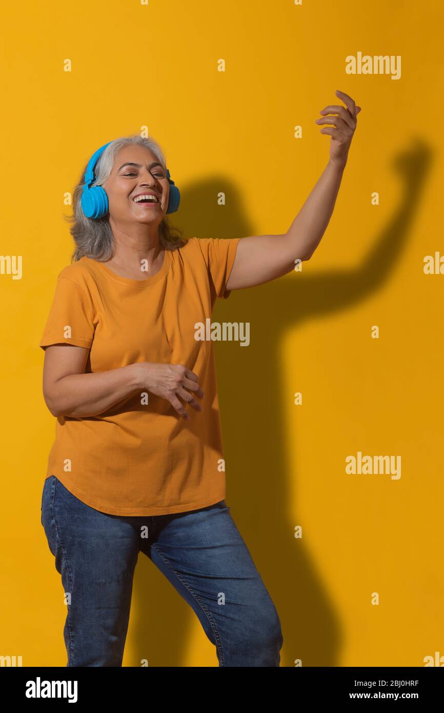 Portrait of a happy grandmother dancing. (Senior Stock Photo - Alamy