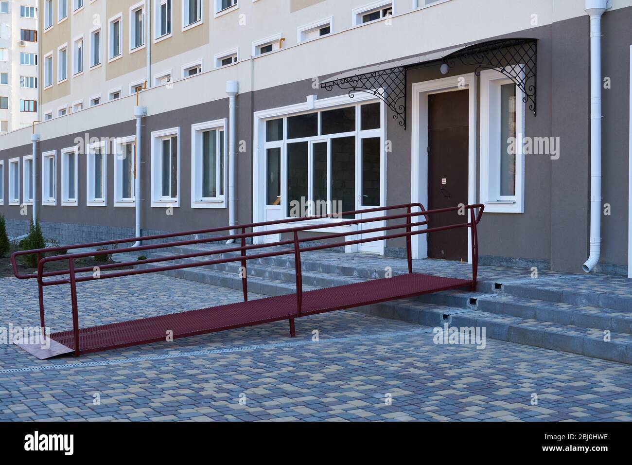 Wheelchair access ramp for entrance of residential multistory building ...