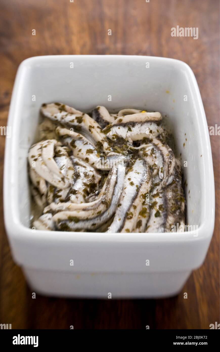 Marinated anchovy fillets in parsley, garlic orange and lemon marinade ...