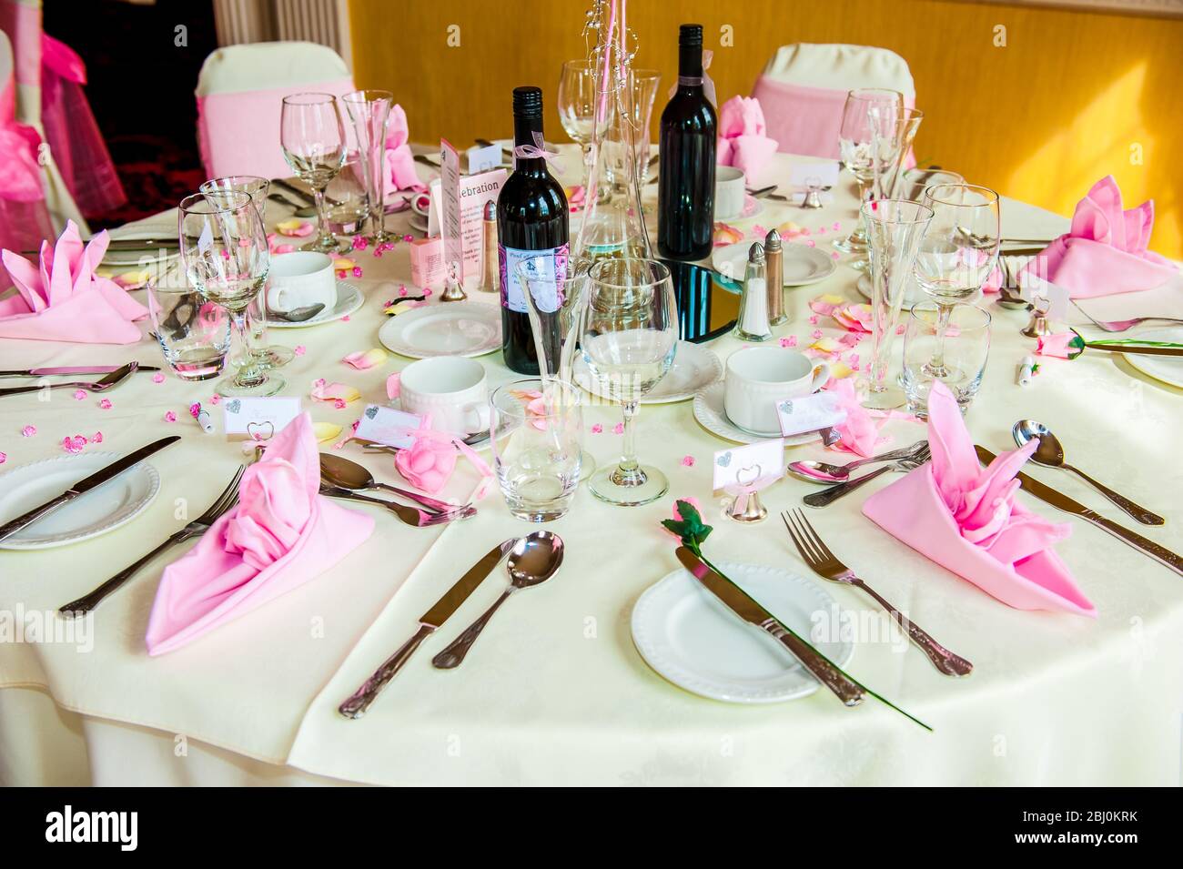 Table set for a Wedding reception with bottles of wine UK Stock Photo ...