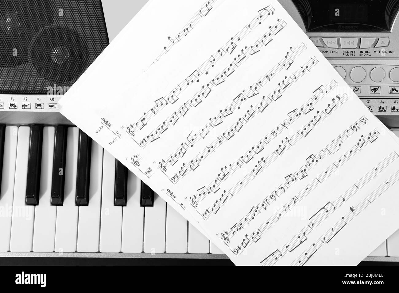 Music notes on synthesizer close up Stock Photo - Alamy