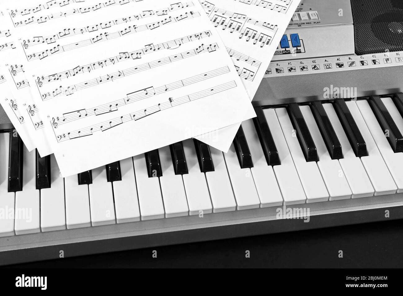 Music notes on synthesizer close up Stock Photo - Alamy