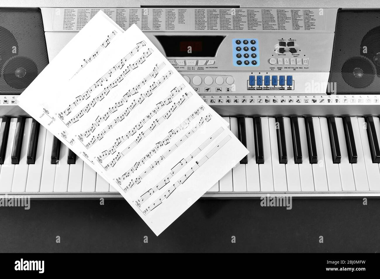 Music notes on synthesizer close up Stock Photo - Alamy