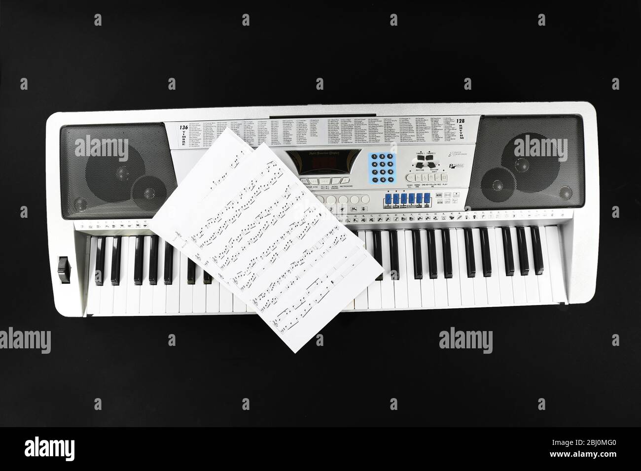Music notes on synthesizer on gray background Stock Photo - Alamy