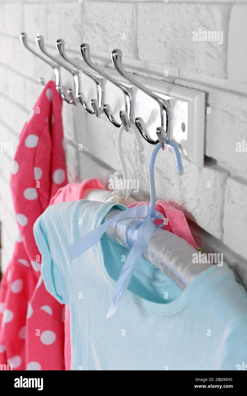 Children things hanging on wall in room Stock Photo - Alamy