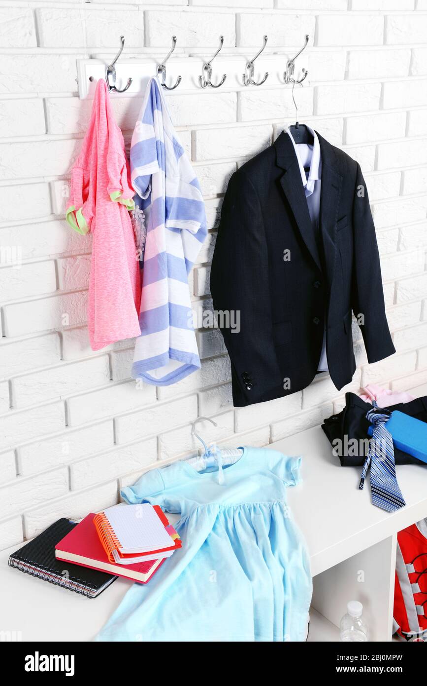 Children things hanging on wall and stacked in room Stock Photo - Alamy