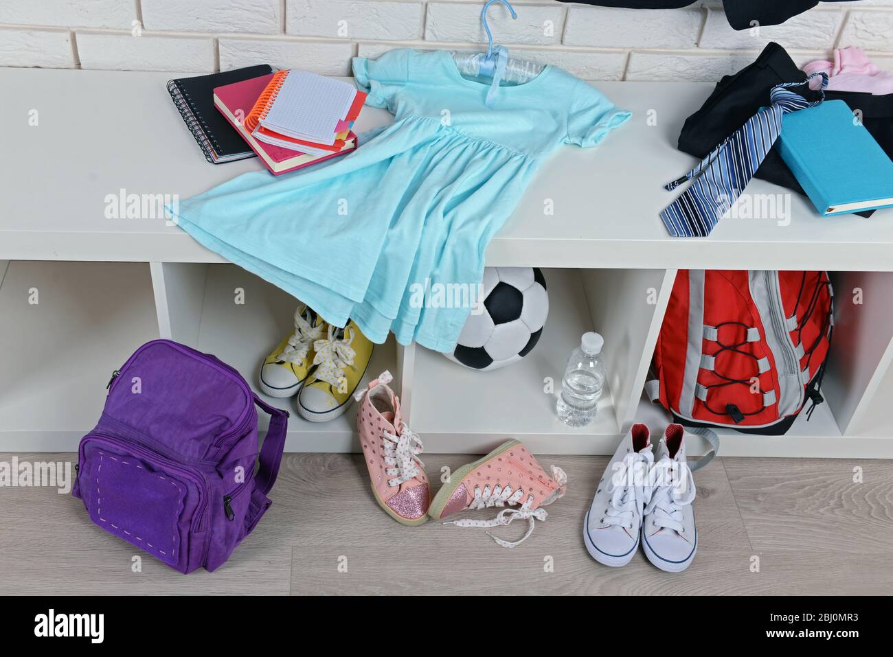 Children things stacked in room Stock Photo - Alamy