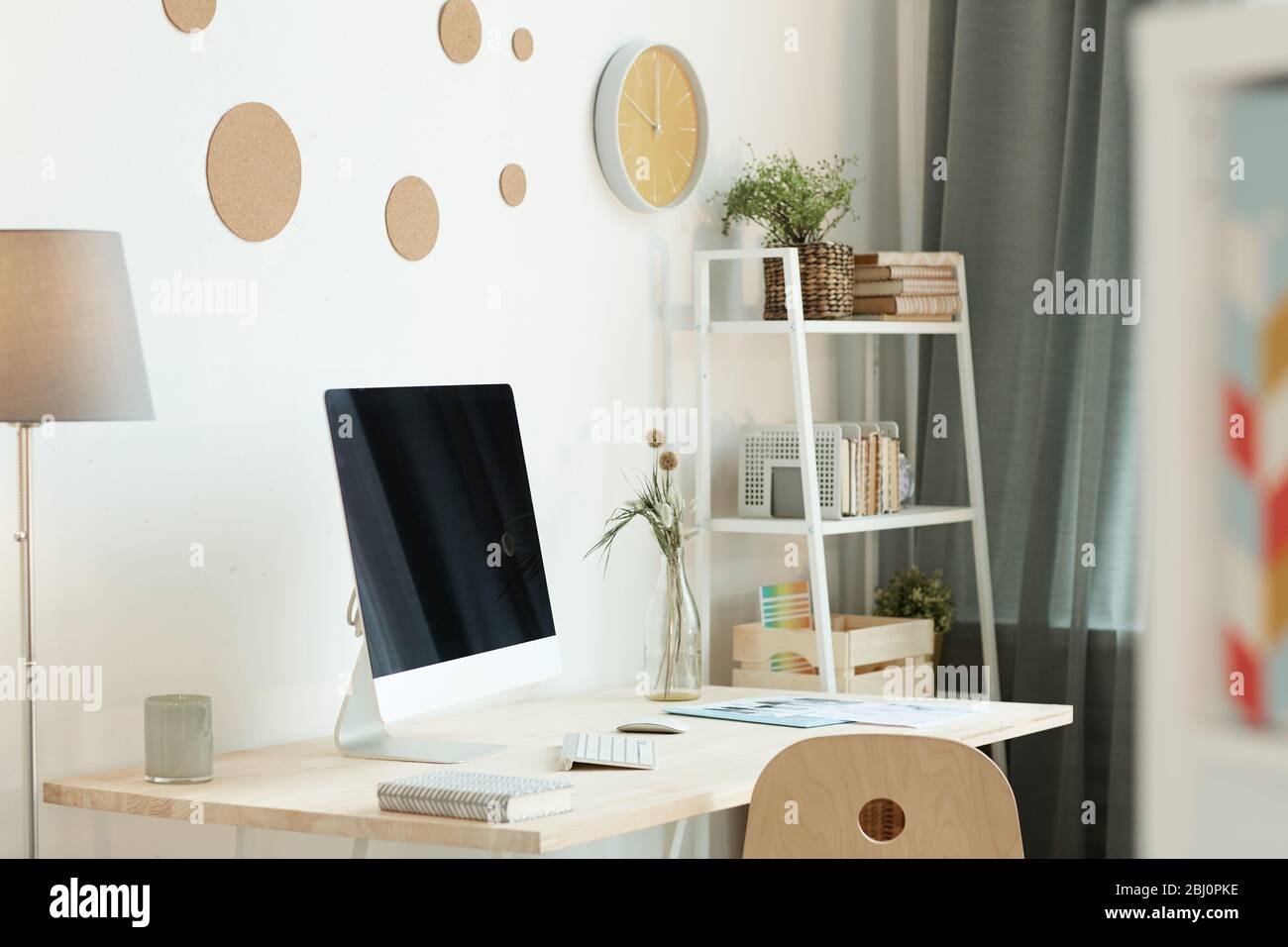 Comfortable workspace in modern room with trendy interior in daylight ...