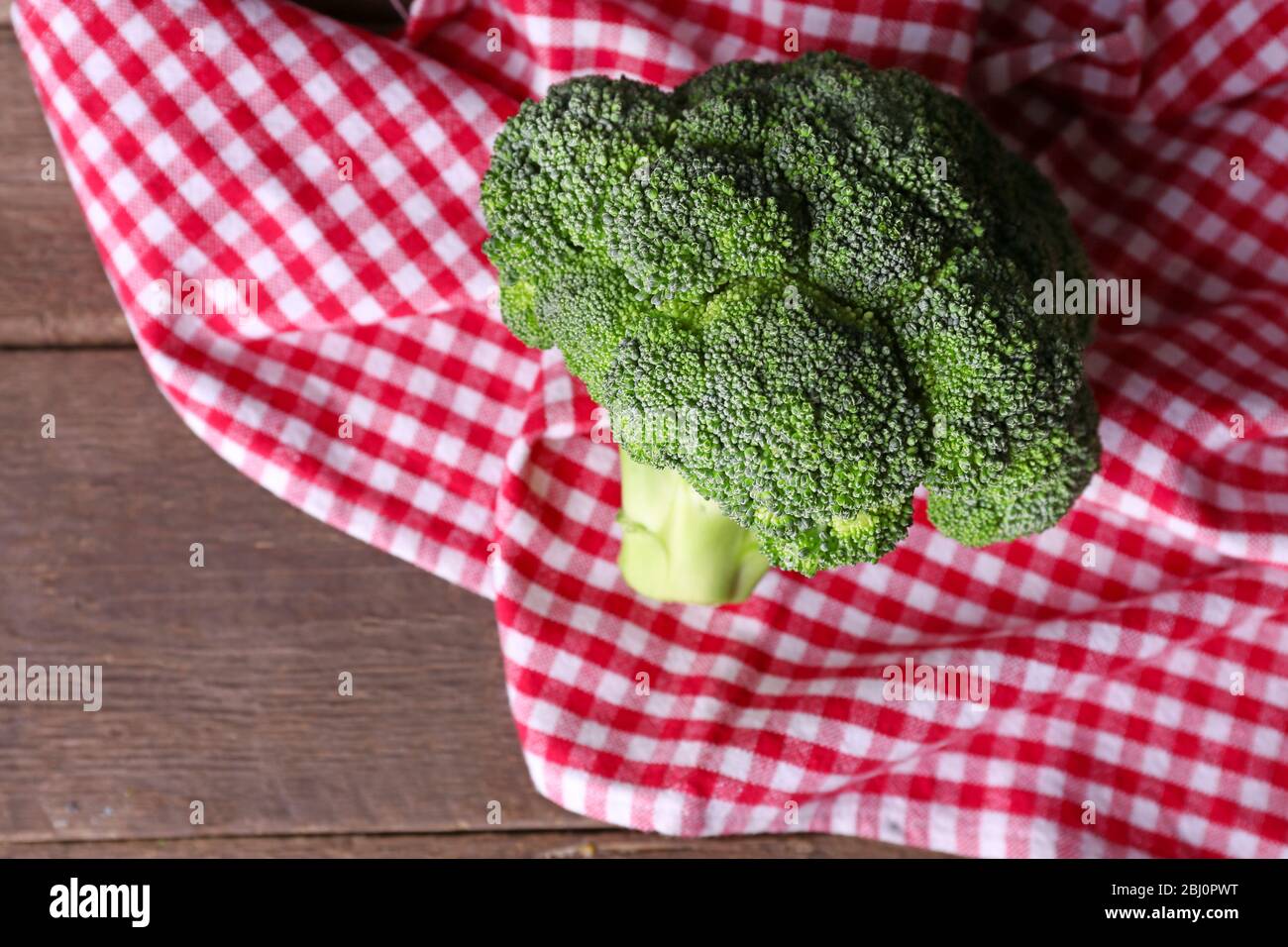 Fresh broccoli on wooden table close up Stock Photo - Alamy