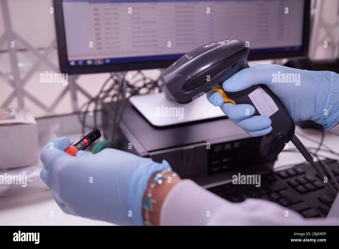 Scanning of medical samples in a testing laboratory Stock Photo - Alamy