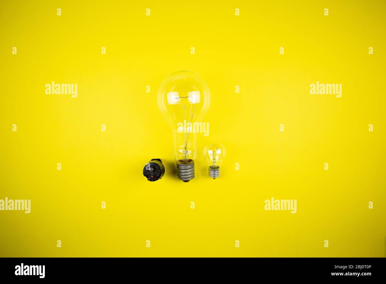 Blew a fuse. Two light bulbs and an electric fuse Stock Photo - Alamy