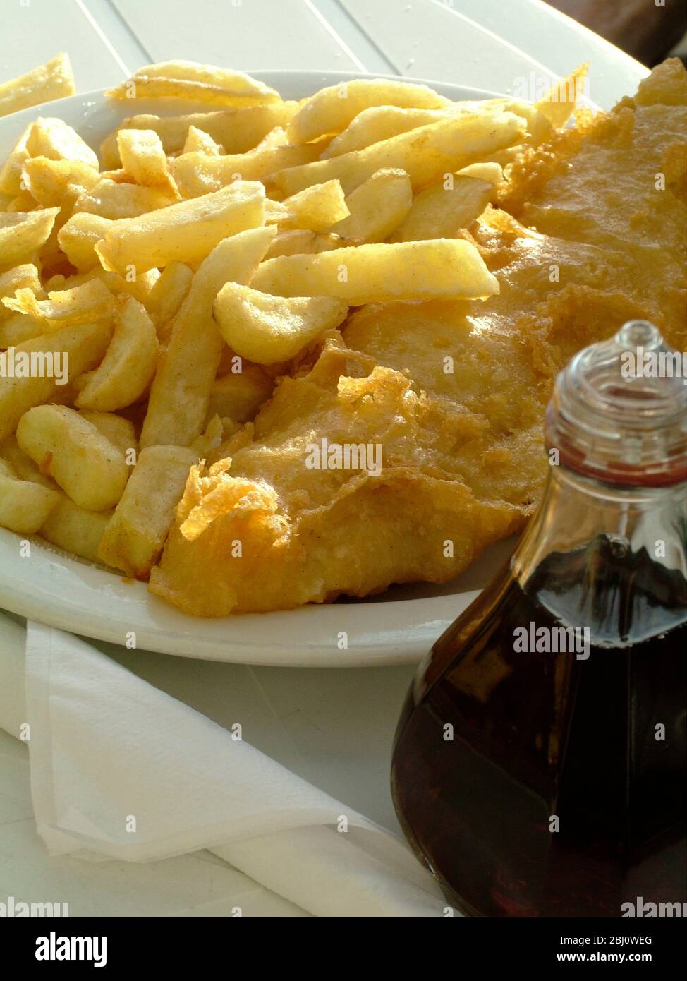 Traditional fish and chips at outdoor cafe on the seafront at Hastings ...