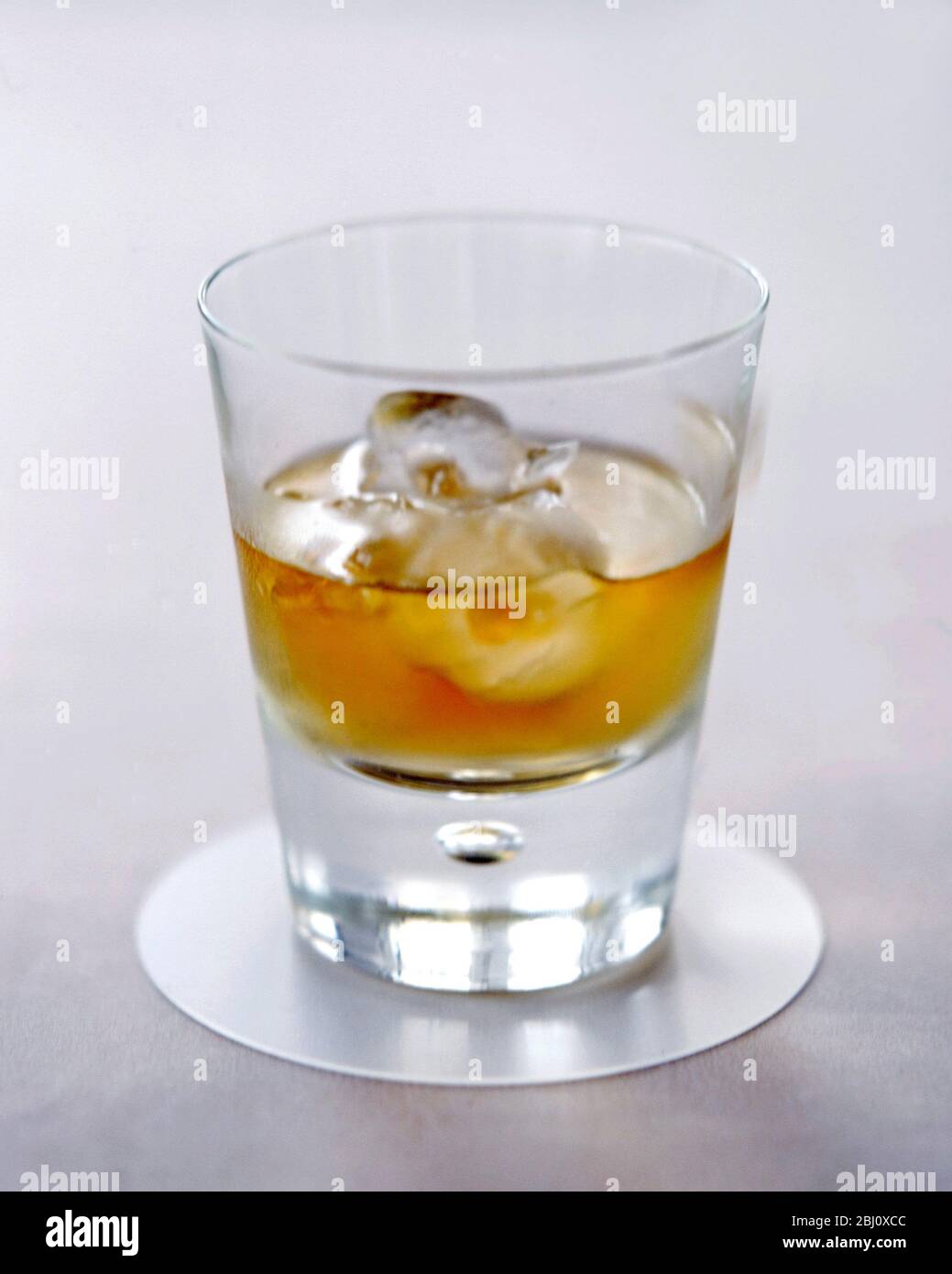 Modern whisky tumbler of straight malt whisky Stock Photo - Alamy